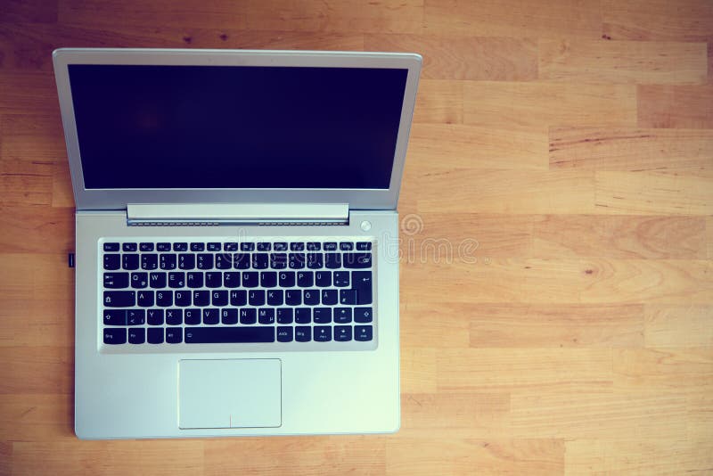 Laptop on wooden ground stock photo. Image of close - 112263664