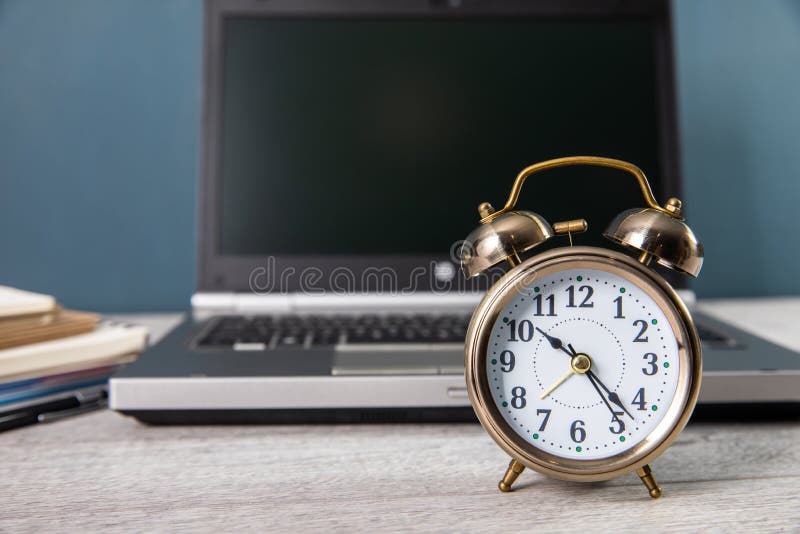 The laptop and alarm clock stock photo. Image of keyboard - 263768508