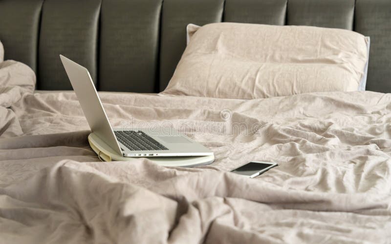Laptop on Bed. Work at Home or Working from Home Concept Stock Image ...