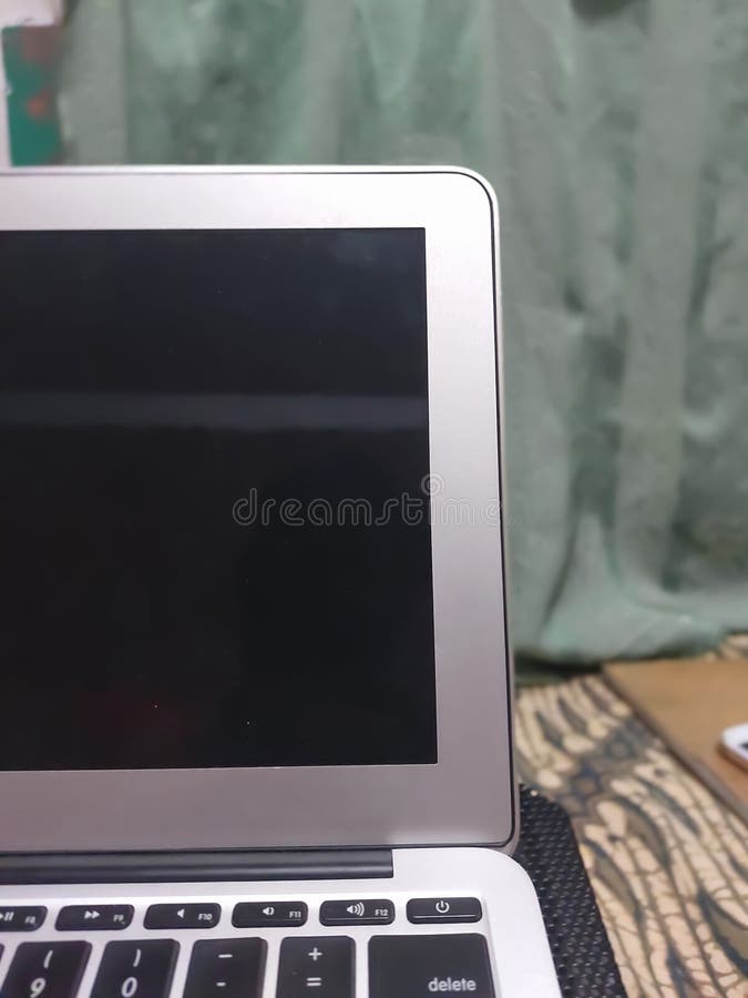 Laptop with Black Screen, Notebook Tilted on Table in Home Interior ...