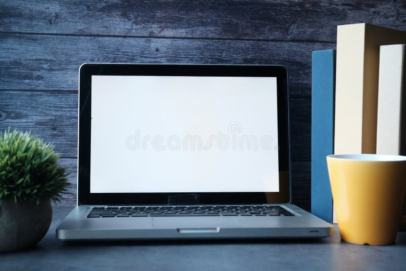 Laptop with Blank Screen and Stack of Books on Table. Stock Image ...