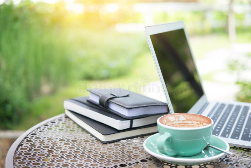 Laptop with Book and Coffee Cup in Garden. Stock Image - Image of ...