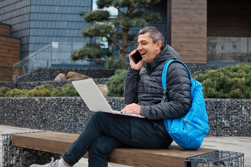 Laptop Browsing Online. Attractive Positive Caucasian Man Sitting on ...