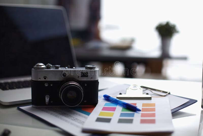 Laptop and Camera on the Desk with Folder Stock Photo - Image of ...