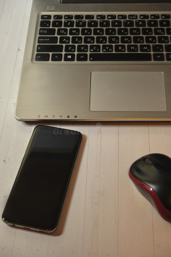 Laptop, Cell Phone and Computer Mouse Stock Image - Image of office ...