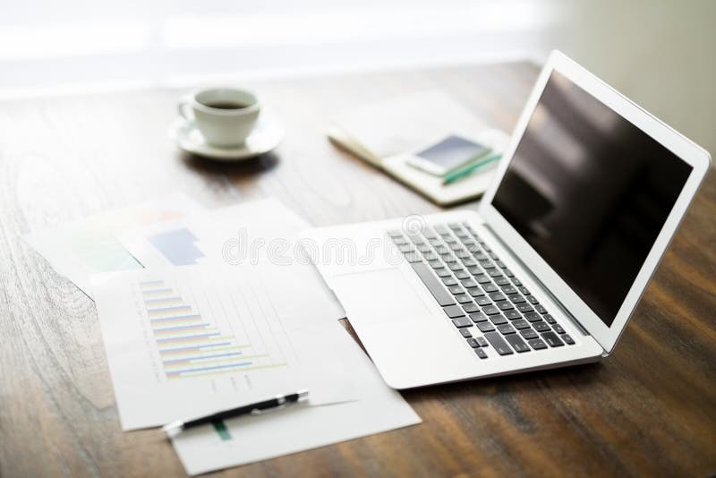 Laptop with Charts on the Table Stock Photo - Image of space, coffee ...