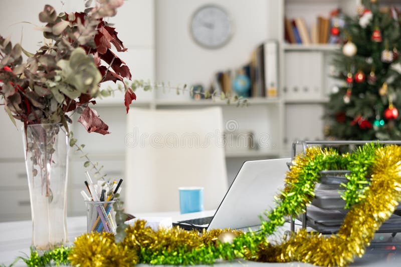 Laptop and Christmas Tinsel on Table in Office. Office Workplace Stock ...