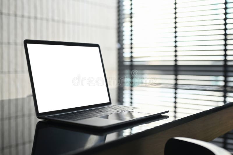 Laptop Computer on Black Glass Table in Modern Workplace. Empty Display ...