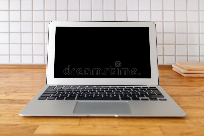 Laptop Computer with Blank Mockup Screen on Kitchen Counter Stock Image ...
