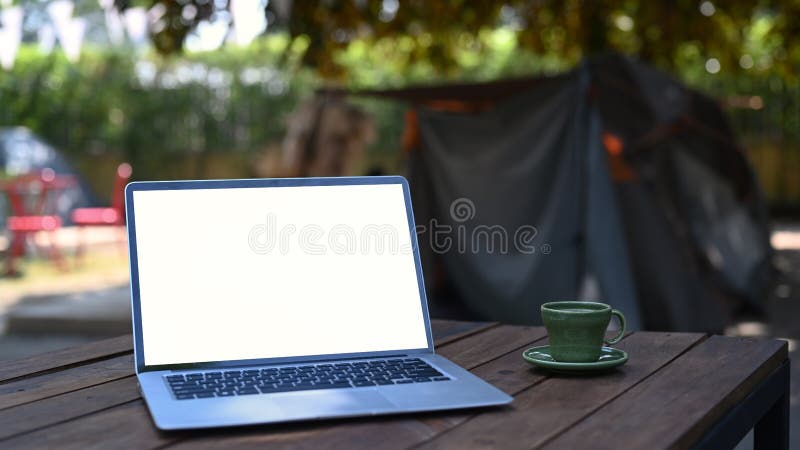 Laptop Computer with Blank Screen and Coffee Cup on Wood Table Near ...