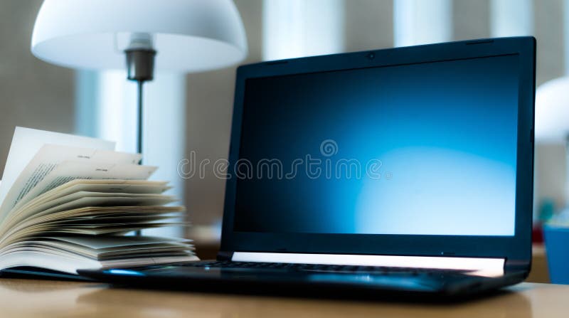 Laptop Computer and a Book on the Desk in Public Library Stock Photo ...