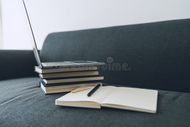 Laptop or Computer with Book Stack . Business and Education Concept ...