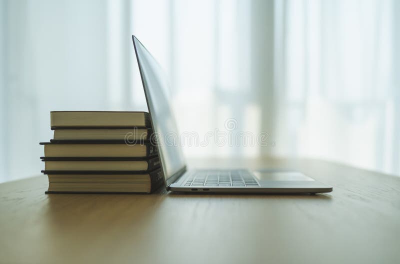 Laptop or Computer with Book Stack . Business and Education Concept ...