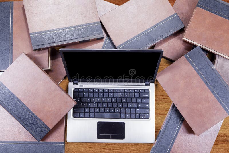 Laptop computer with books stock image. Image of internet - 59647861