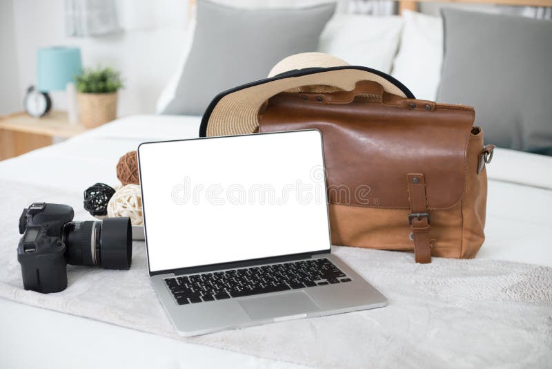 Laptop Computer Camera and Camera on Bed. Stock Image - Image of white ...