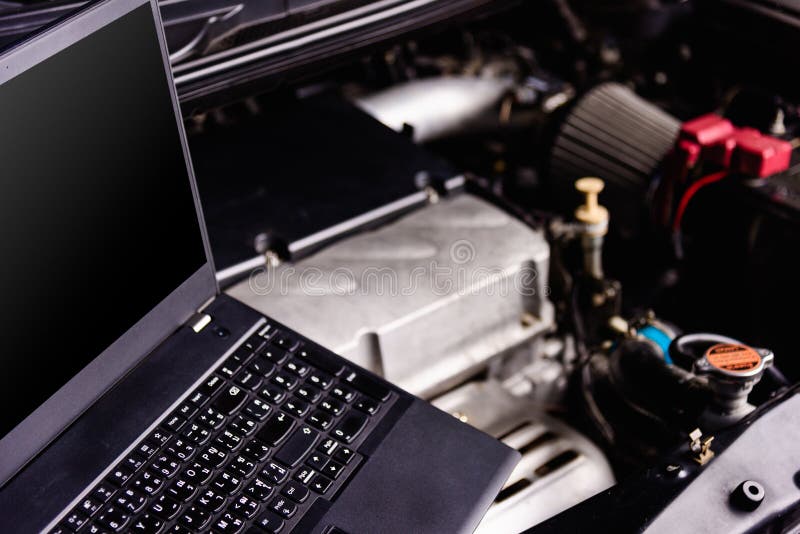 Laptop Computer on Car Mechanic Engine for Service Stock Photo - Image ...