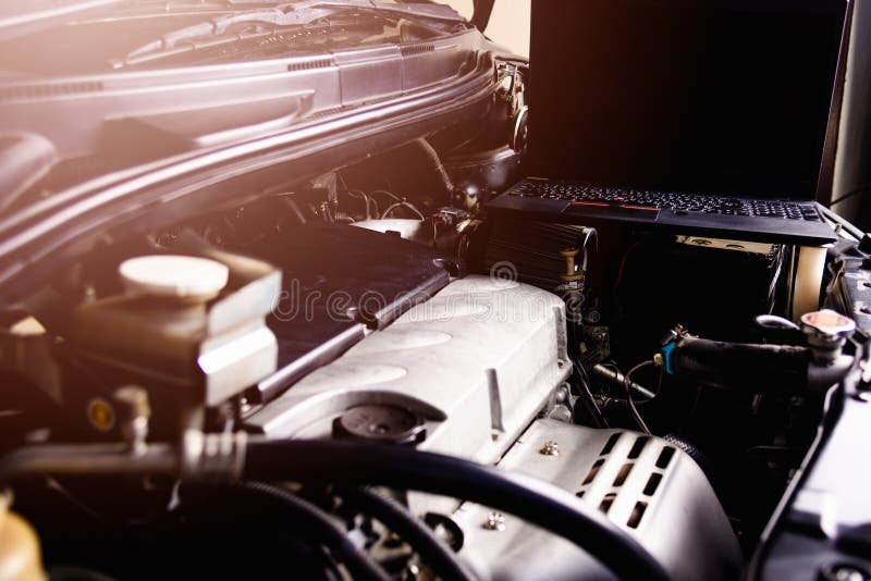 Laptop Computer on Car Mechanic Engine for Service Stock Photo - Image ...