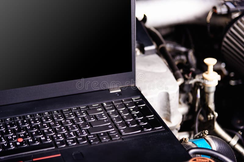 Laptop Computer on Car Mechanic Engine for Service Stock Photo - Image ...