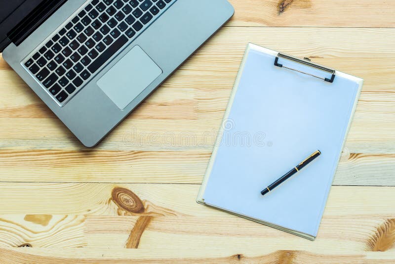 Laptop Computer with Clipboard Note Pad on Desk Stock Photo - Image of ...