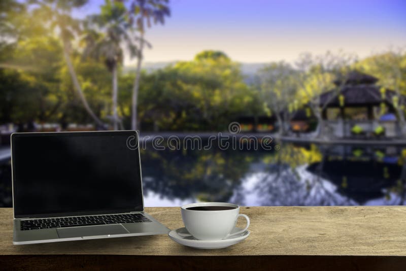 Laptop Computer with Coffee Cup on Wood Table on Relaxation in Summer ...