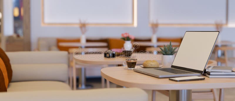 A Laptop Computer on a Coffee Table in a Modern Co-working Space in the ...