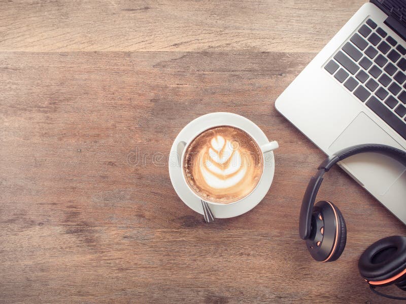 Laptop Computer with Cup of Coffee and Headphones on Old Wooden Stock ...