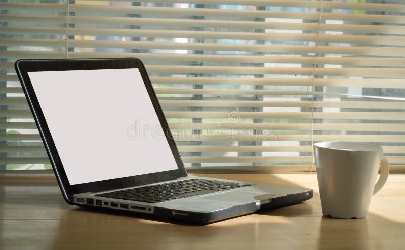 Laptop computer and cup stock photo. Image of modern - 63846322