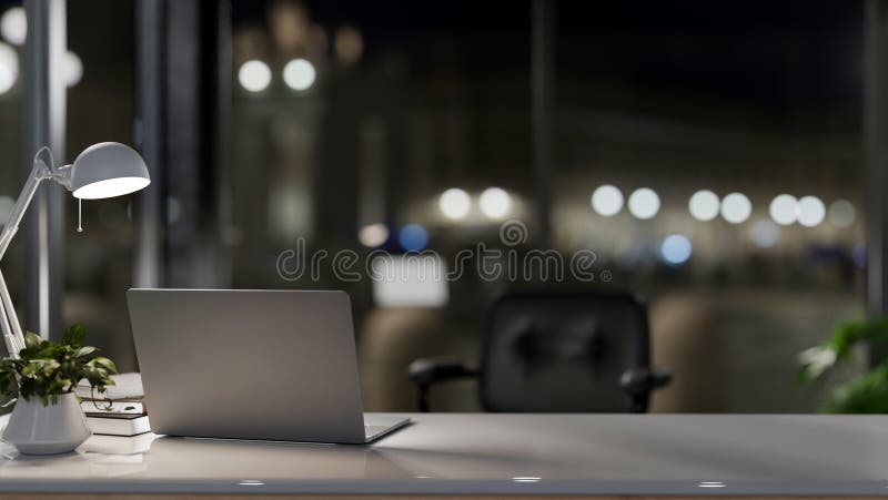 A Laptop Computer on a Desk in a Modern Private Office at Night ...