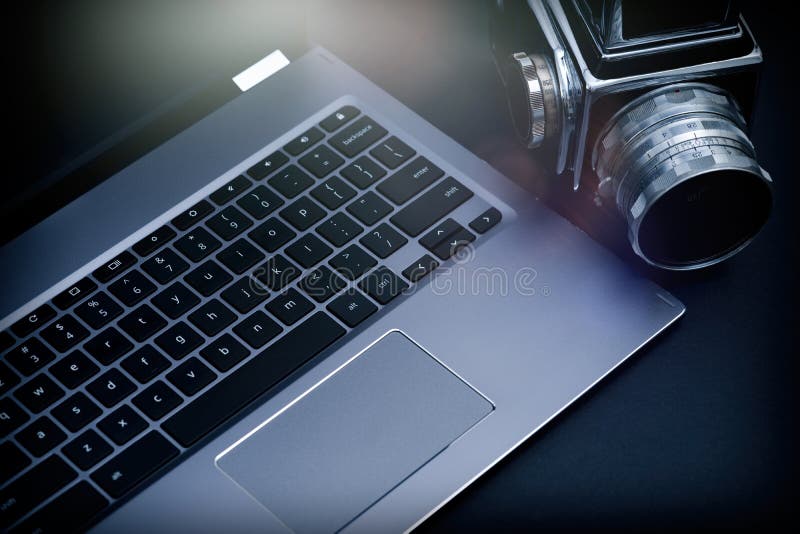 Laptop Computer and Film Camera on the Table Stock Image - Image of ...