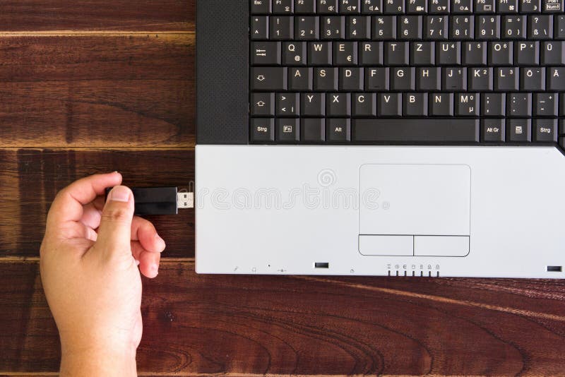 Laptop Computer and Hand with USB Flash Drive. Selective Focus Stock ...