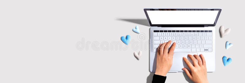 Laptop Computer with Heart Cushions Stock Photo - Image of love ...