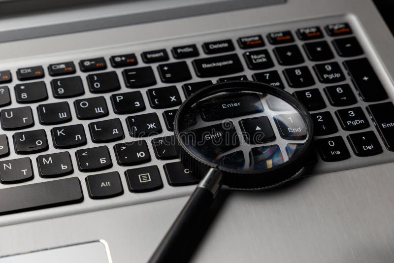 Laptop Computer with Magnifying Glass on Blue Background, Concept of ...