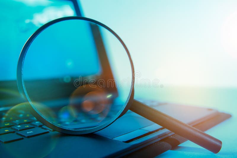 Laptop Computer with Magnifying Glass Stock Image - Image of ...