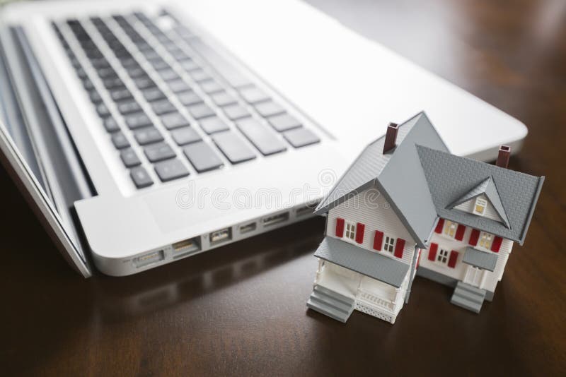 Laptop Computer and Miniature House Stock Photo - Image of cyber, keys ...