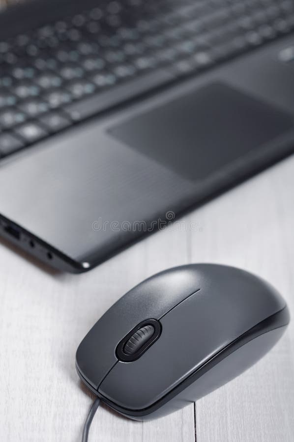 Laptop with computer mouse stock photo. Image of store - 29168992