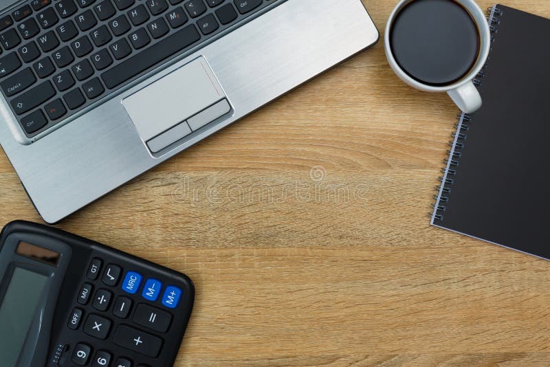 Laptop Computer or Notebook, Calculator and Cup of Coffee on Working ...