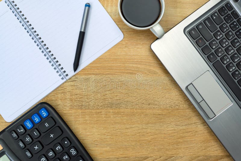Laptop Computer or Notebook, Calculator and Cup of Coffee on Working ...