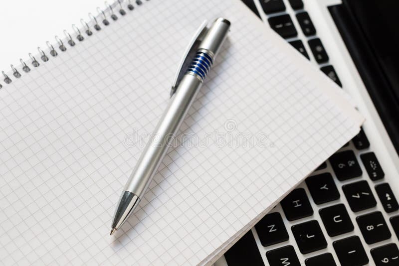 Laptop Computer with Notepad, Pen on Ivory Table Stock Photo - Image of ...
