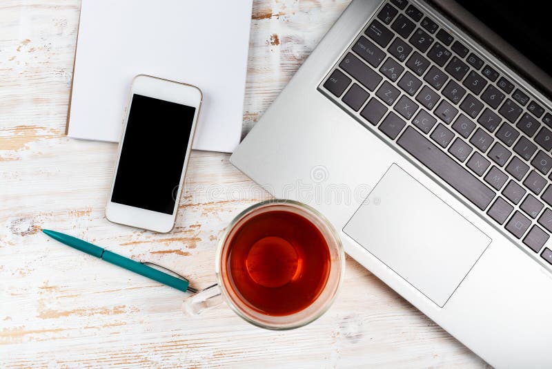 Laptop Computer, Planner, Mobile Smartphone and Cup of Tea Stock Image ...