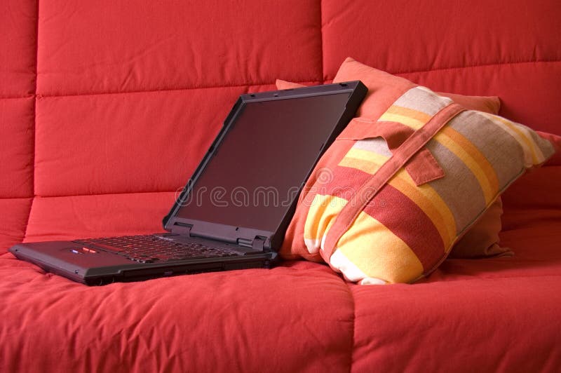 Laptop Computer on Red Couch Stock Image - Image of technology, home ...