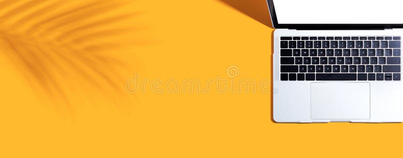 Laptop Computer with Shadow of Tropical Leaf Stock Photo - Image of ...