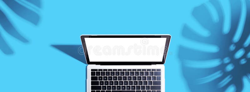 Laptop Computer with Shadow of Tropical Leaves Stock Photo - Image of ...