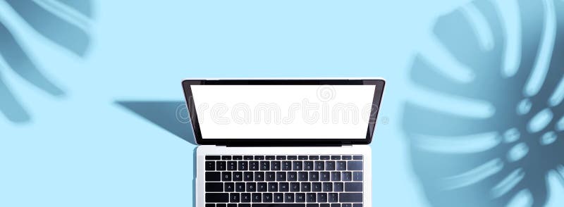 Laptop Computer with Shadow of Tropical Leaves Stock Image - Image of ...