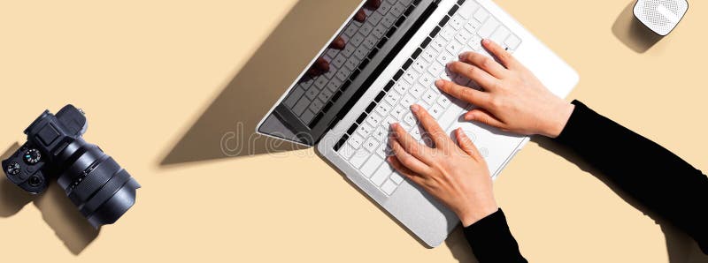 Laptop Computer with a SLR Camera Stock Photo - Image of photographer ...