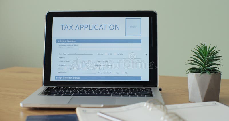 Laptop Computer with an Tax Application Form on Its Display. Stock ...