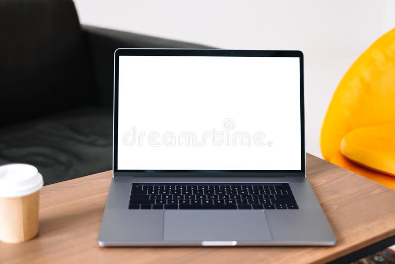 Laptop Computer with White Blank Screen Mock Up on the Table in Living ...