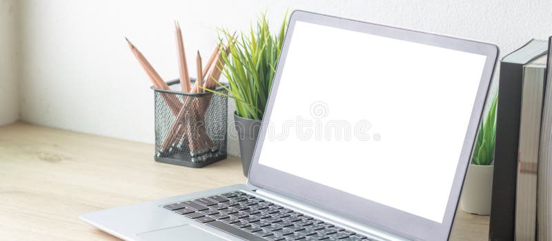 Laptop Computer with White Blank Screen on Wood Desk. Workspace ...