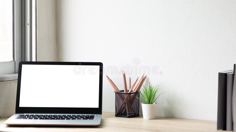 Laptop Computer with White Blank Screen on Wood Desk. Workspace ...