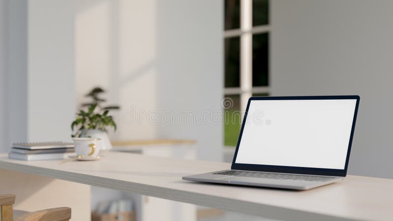 A Laptop Computer with a White Screen Mockup on a Light Wood Table in a ...
