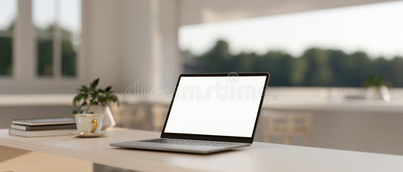 A White-screen Laptop Mockup on a White Dining Table in a Modern ...